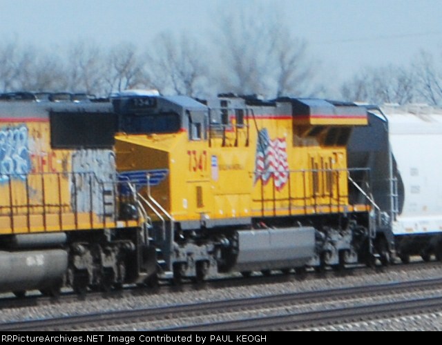 UP 7347 rolls west as a 3d unit on a grain train towards North Platte yard.